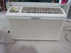 Goldstar 5000 BTU window AC. Powers up. - AAA Auction and Realty