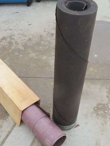 Roll of tar paper and some 80-grit sandpaper - AAA Auction and Realty