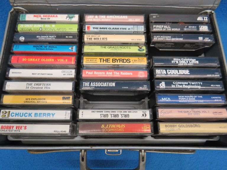 Cassette tapes in a carrying case. Rolling Stones, Rod Stewart, 50s ...
