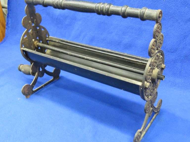 Vintage cast iron newspaper log roller - AAA Auction and Realty