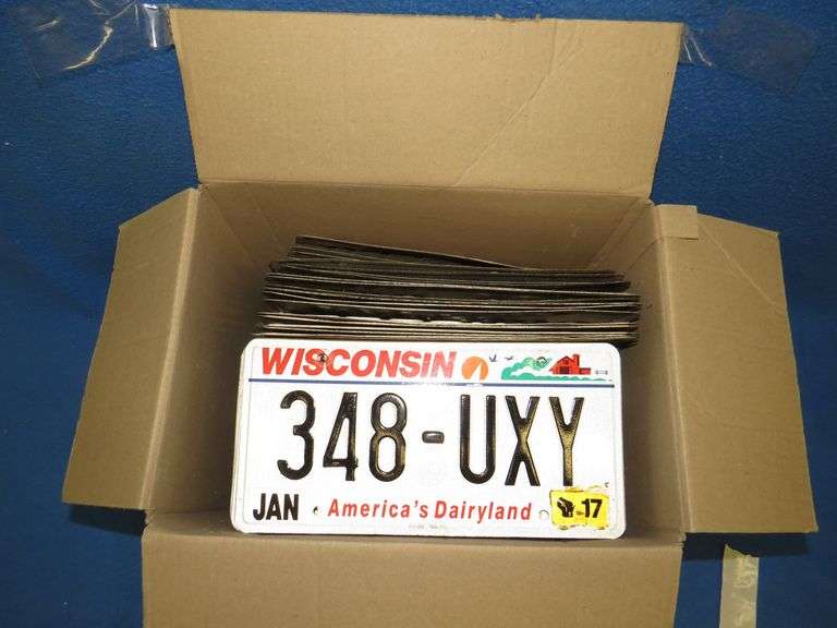 26 lbs. of Wisconsin license plates - AAA Auction and Realty