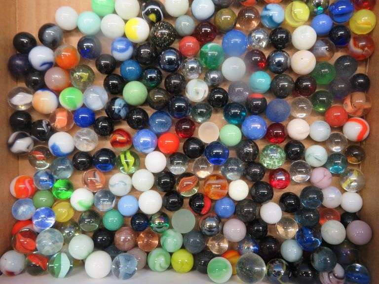 Two different sizes of marbles - AAA Auction and Realty
