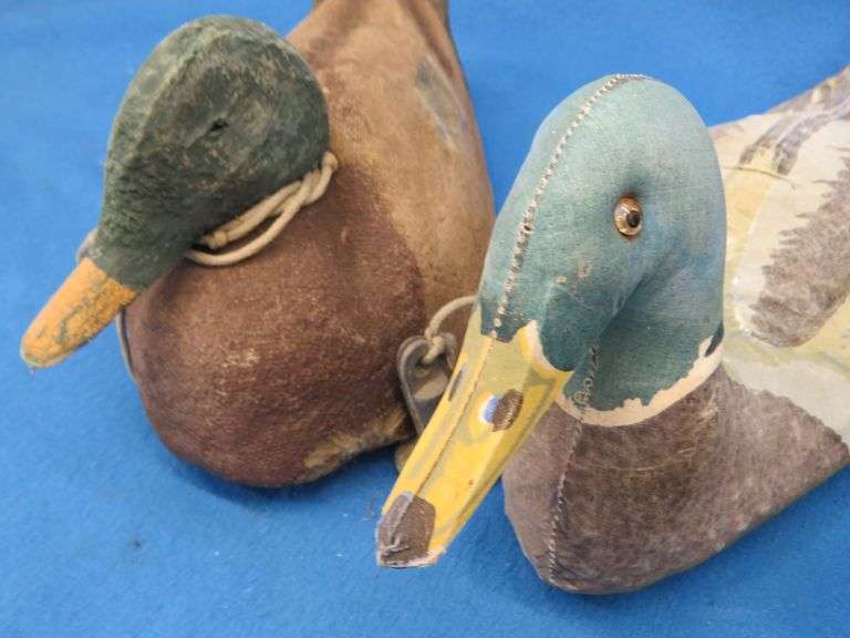 Three vintage duck decoys, two are painted cork and one is cloth ...