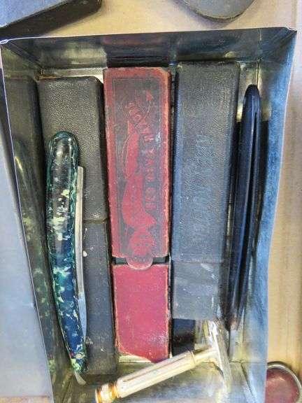 Metal box with many vintage straight-edge razors - AAA Auction and Realty