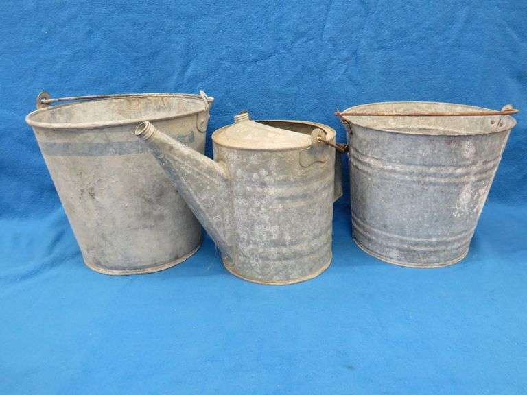 Two galvanized pails and a watering can - AAA Auction and Realty