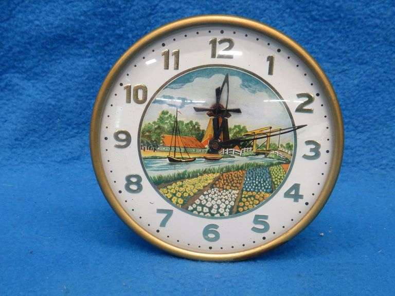 Working animated wind-up desk clock. Windmill arms turn. No maker's ...