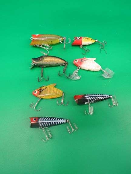 Seven Heddon baits: Two tiny Chuggers, Baby and Tiny Lucky 13's, River Runt, and two Sonics ...
