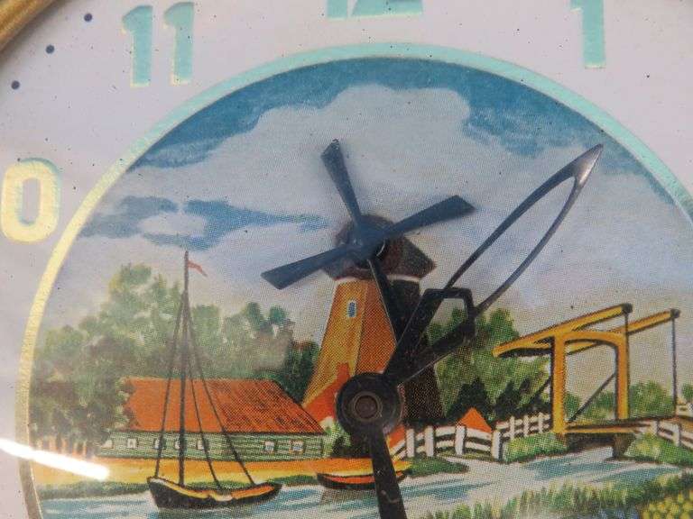 Working animated wind-up desk clock. Windmill arms turn. No maker's ...