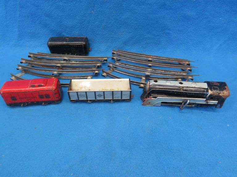 Hafner train set. Includes a wind-up working engine, three cars, and ...