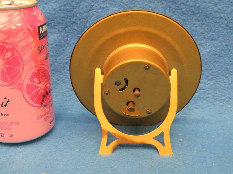 Working animated wind-up desk clock. Windmill arms turn. No maker's ...