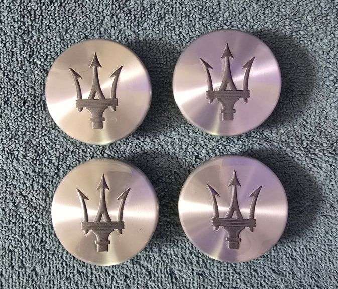 Maserati Center Caps - Lil Dusty Online Auctions - All Estate Services, LLC