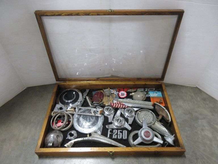 Small wood display case full of automotive related parts and items ...