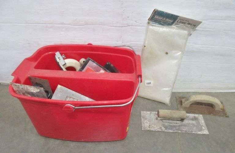 Red pail full of tiling and grouting tools, there are (9) piece plus a ...