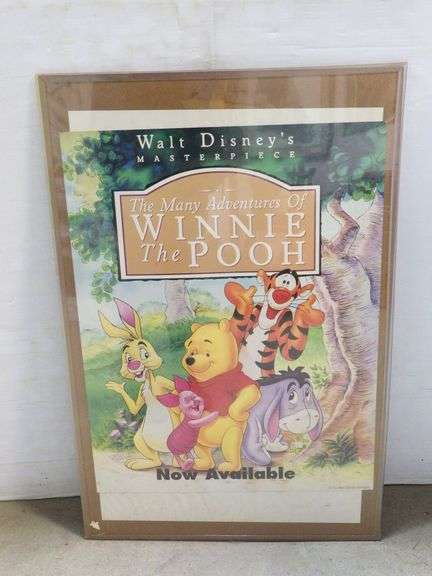 Framed Winnie the Pooh poster with an Aladdin movie poster behind it ...