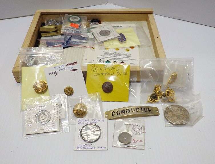 Shadow box of various railroad coins, buttons, and other paraphernalia ...