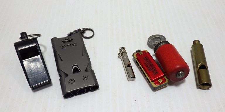 (2) Dog whistles, (2) Whistles, mini harmonica, and a bird twist ...