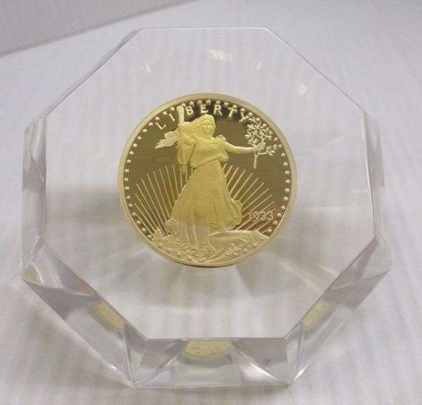 Diamond shaped acrylic paperweight with gold-toned coin inside ...