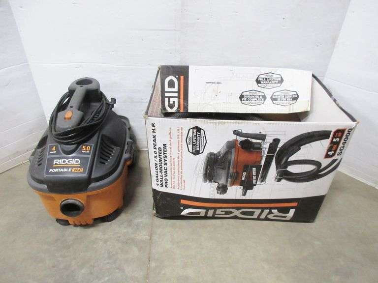 Ridgid Pro Vac 5 HP four-gallon portable wet/dry vac system with wall ...