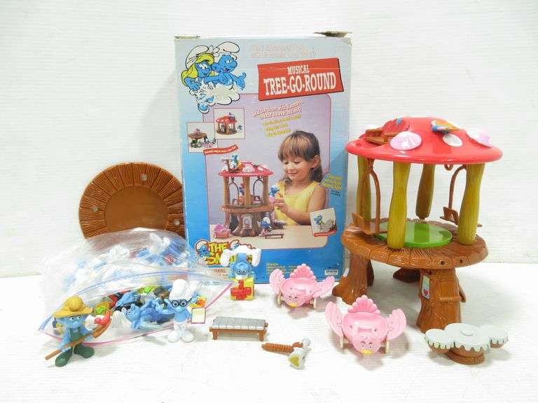 Smurfs musical tree-go-round with 20- Smurfs, plays music, needs a push ...
