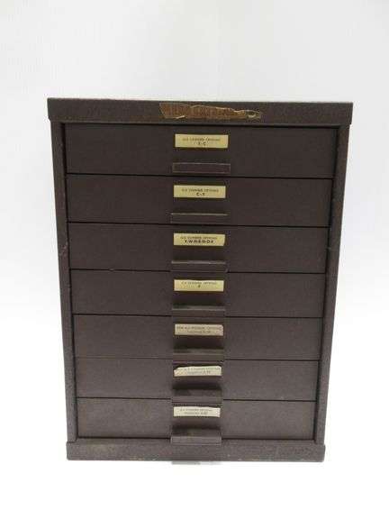 Watchmaker's crystal cabinet with seven drawers, mostly full ...