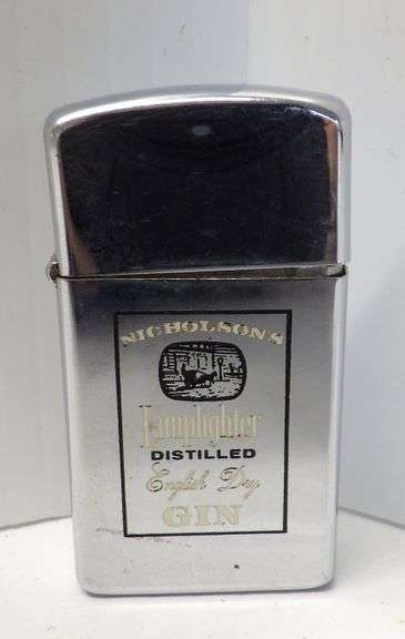 1962 Zippo Lighter states, "Lamplighter Gin" - Albrecht Auction Service