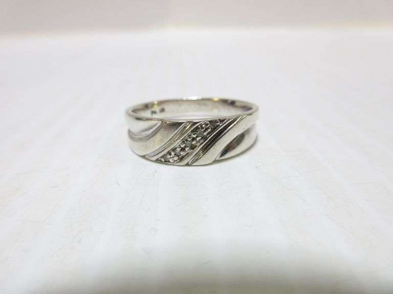 Diamond wedding band, stamped P4SR which is a mixture of silver, gold ...