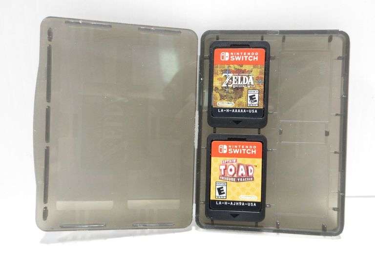 (2) Nintendo Switch games in a black Zelda game cartridge carrying case ...