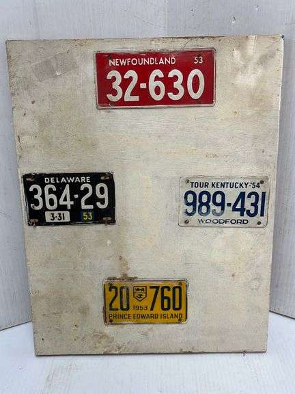 (4) Small license plates, attached to board, plates- 5"L, board- 11"W x ...