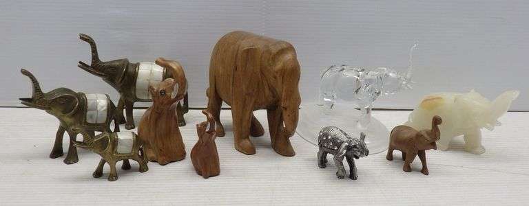 (4) Wood elephants, (3) Brass elephants with mother of pearl saddles ...