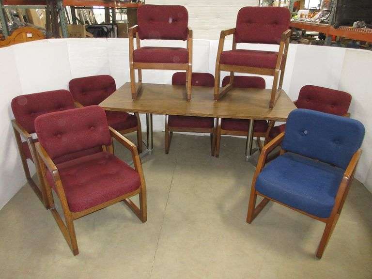 Dine/conference/work table with (8) burgundy swirl chairs and a blue ...