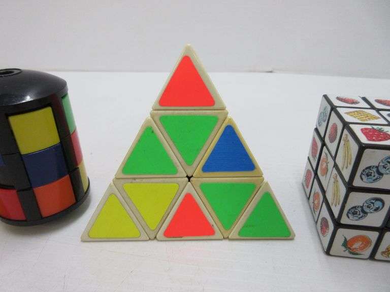 Rubik's cube type puzzles, includes: Rubik's cube, (2) Chex Brand fruit ...