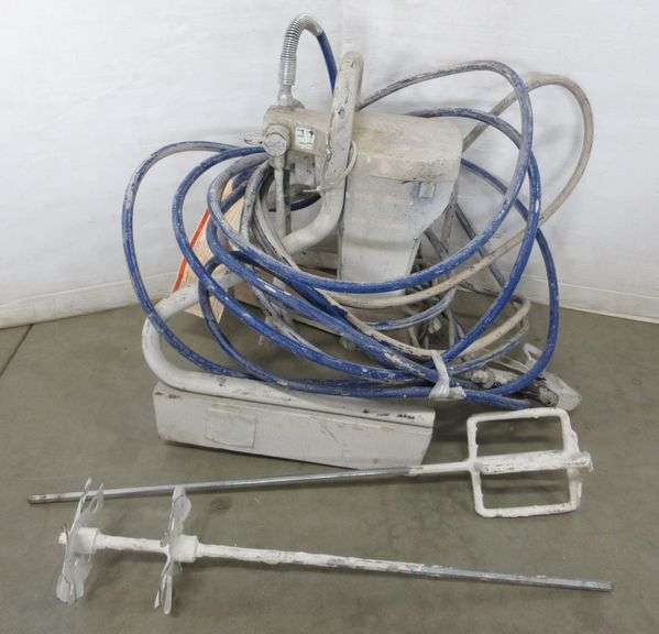 Commercial airless paint sprayer with two stirring paddles, used in 5 ...