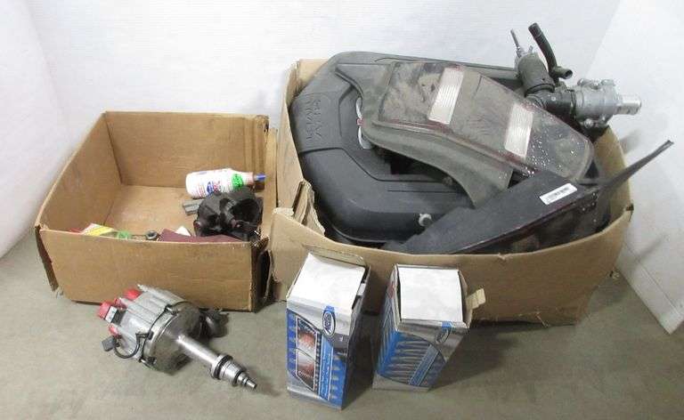 (2) Boxes of car parts, good - Albrecht Auction Service