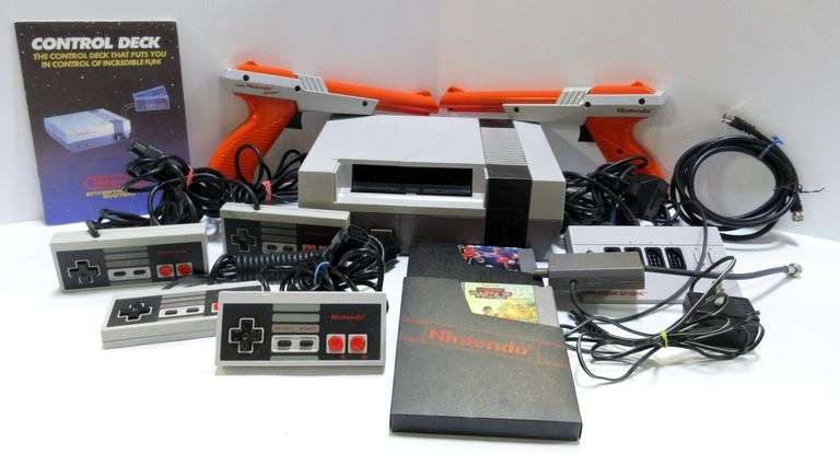 NIntendo MES system, model NES-001, has 1 3/4" crack above chamber door ...