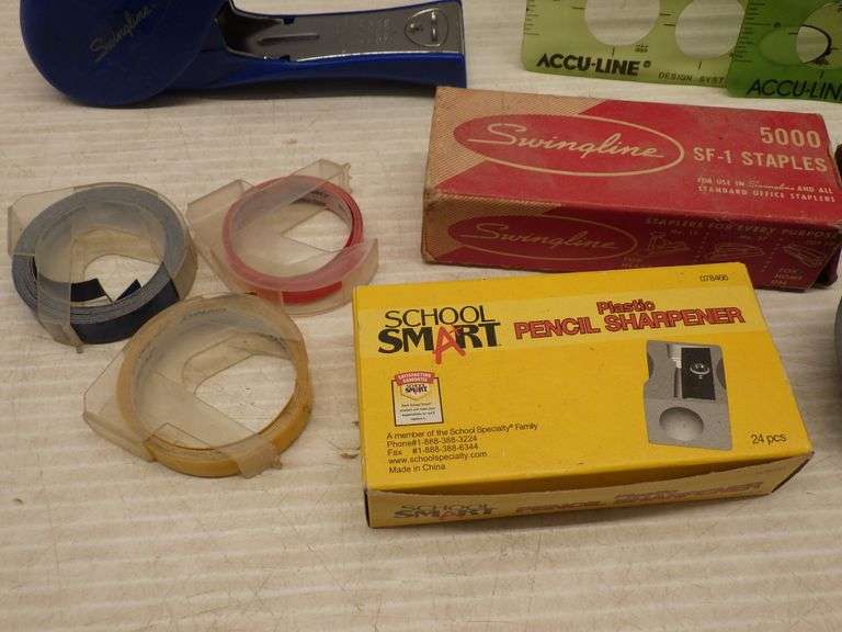 Label maker with extra strip cartridges; Stapler and box of staples ...