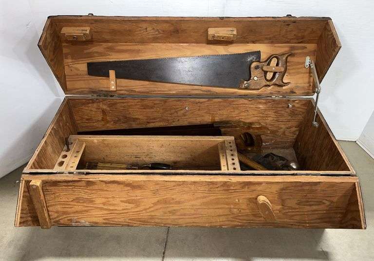 Carpenters tool chest with hand saws, drills, tape measurer, and more ...