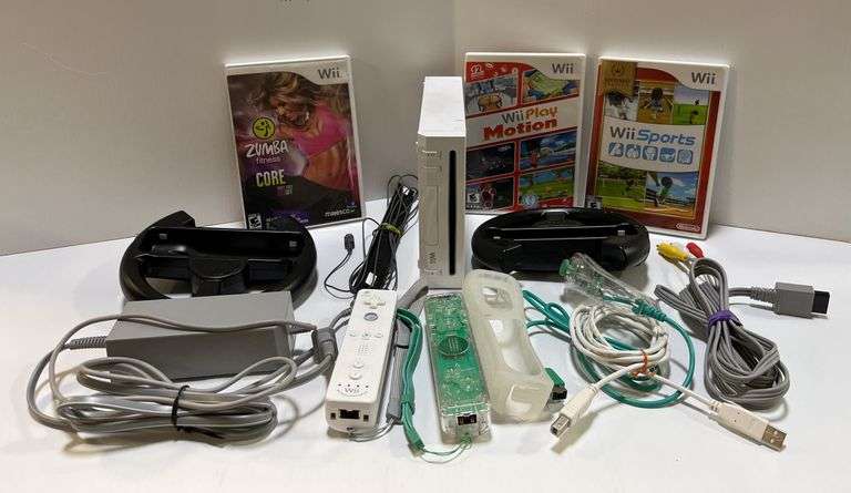 Wii, model no. RVL 1001, with (2) nunchucks, (2) steering wheels ...