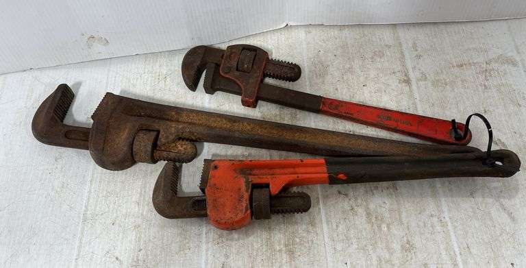 Older 24" RIDGID pipe wrench, and (2) Heavy duty 18" pipe wrenches ...