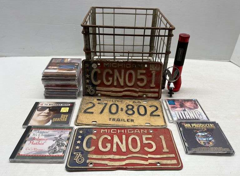 CDs, license plates, flashlight in old metal milkcrate - Albrecht ...