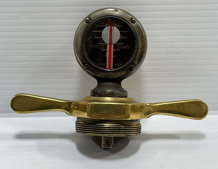 Older Boyce motometer midget model attached to a solid brass dog bone ...