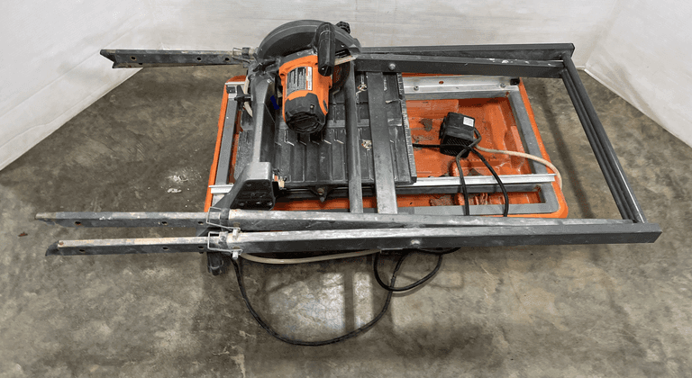Ridgid model R4030 7" tile cutting wet saw with stand, 44"L, fair ...