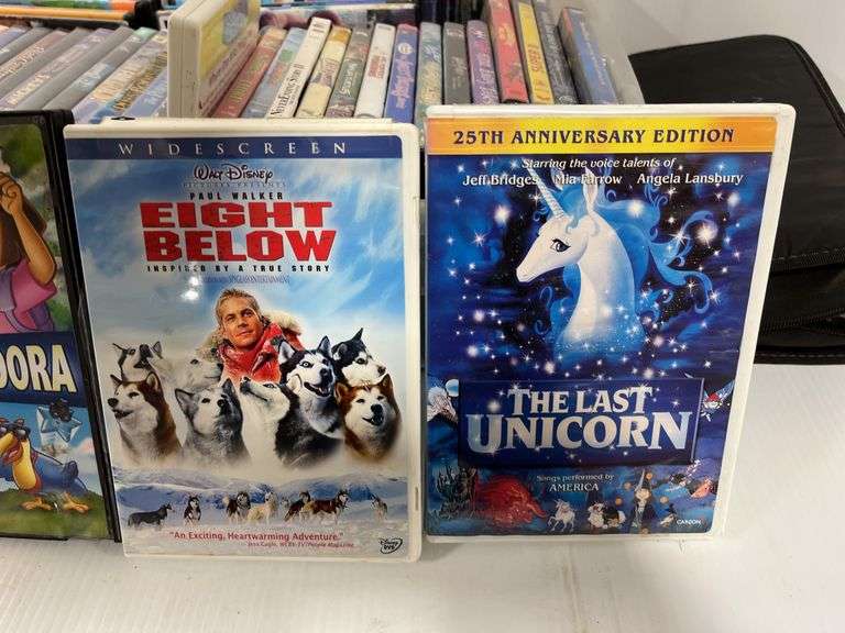 (50) DVDs in cases, include: Kids and PG movies; (64) Movies in book ...