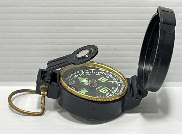 Engineer lensatic compass, measuring directions to objects, land ...