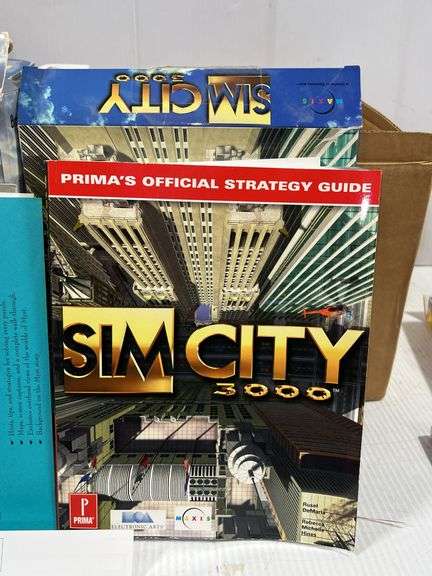 Older computer games, with SIM tower, SIMCity 3000, Myst, Resume Deluxe ...