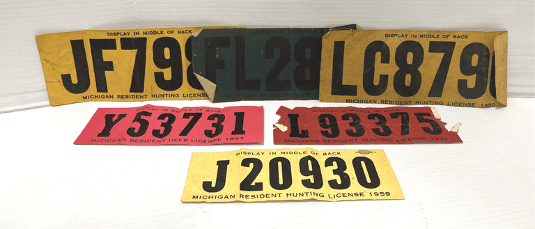 (9) Michigan deer hunting back tags, 1940's and 1950's, up to 8"W ...