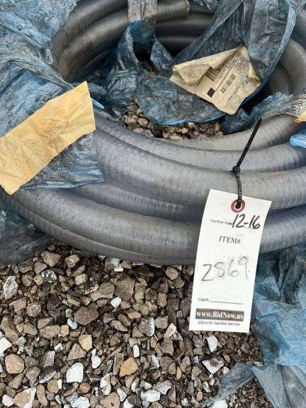 Roll of 1 1/4" Plastic tubing, 100', new - Albrecht Auction Service