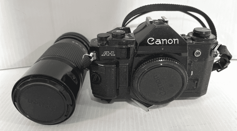 Canon camera with Canon 7-150mm lens, good - Albrecht Auction Service