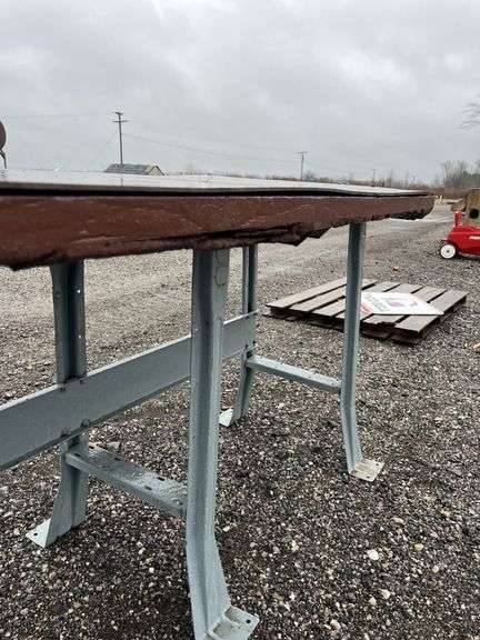 Very heavy duty workbench, 2 x 10's with masonite top on three steel legs, will hold a ton of ...