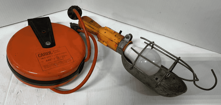 Carol 18' retractable trouble light with one outlet, works great - Albrecht Auction Service