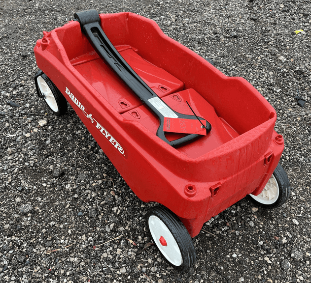 Plastic Radio Flyer wagon, has wear - Albrecht Auction Service
